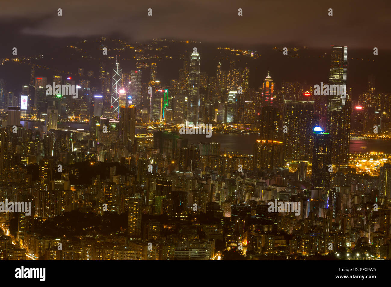 a big asia city by night to the sunrise with all the lights on the ...