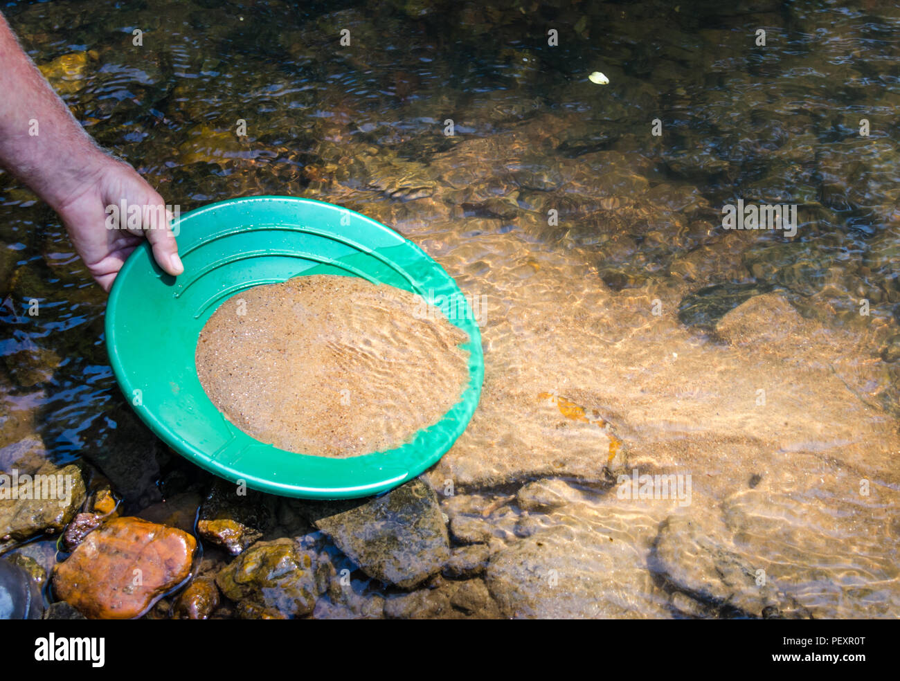 Gold Panning in mineral rich stream. Fun outdoor recreational activity ...