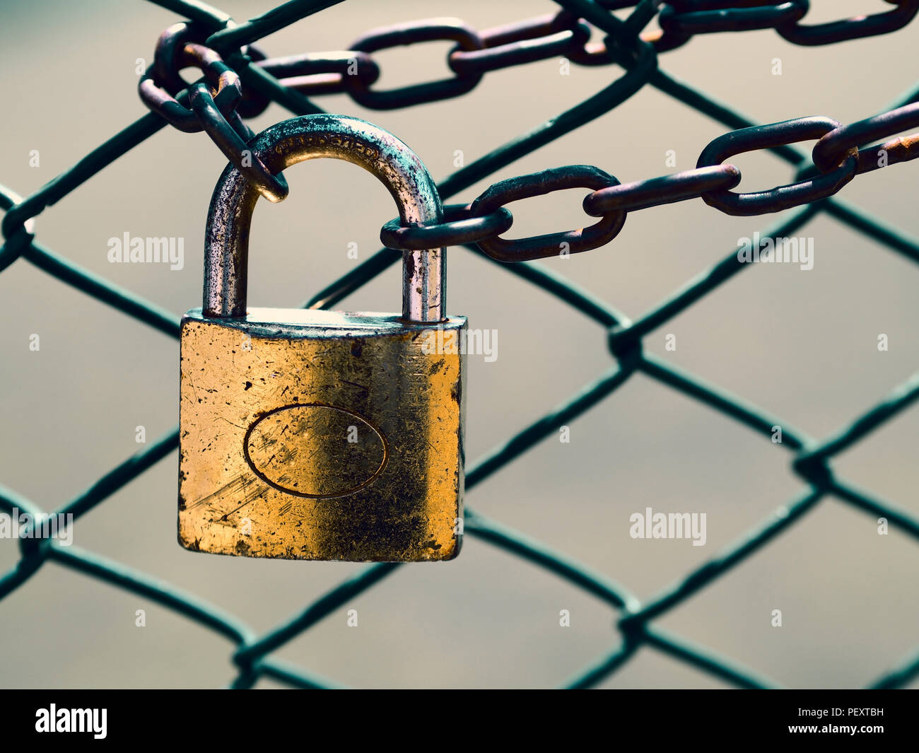 door lock on the iron gate with iron chain and padlock Stock Photo - Alamy
