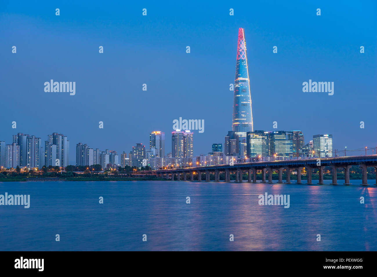 Jamsil railway bridge crossing the Han River and Lotte World Tower in ...
