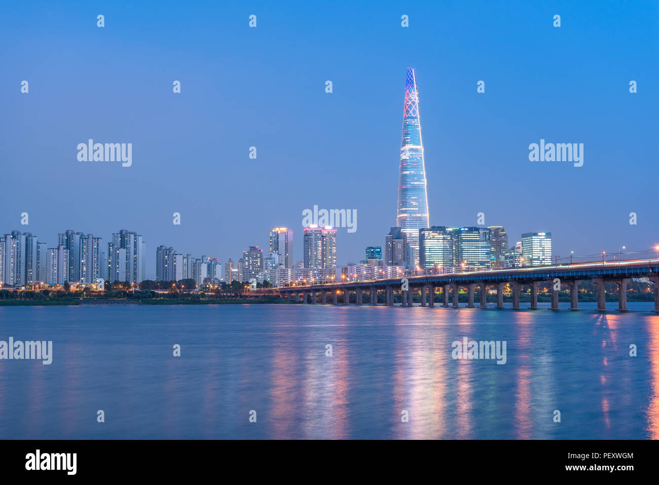 Jamsil railway bridge crossing the Han River and Lotte World Tower in ...
