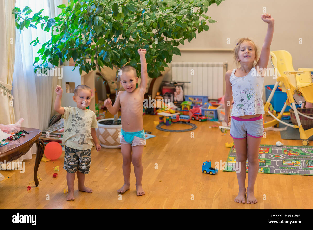 Children make exercises. The concept of a healthy lifestyle. Children's ...