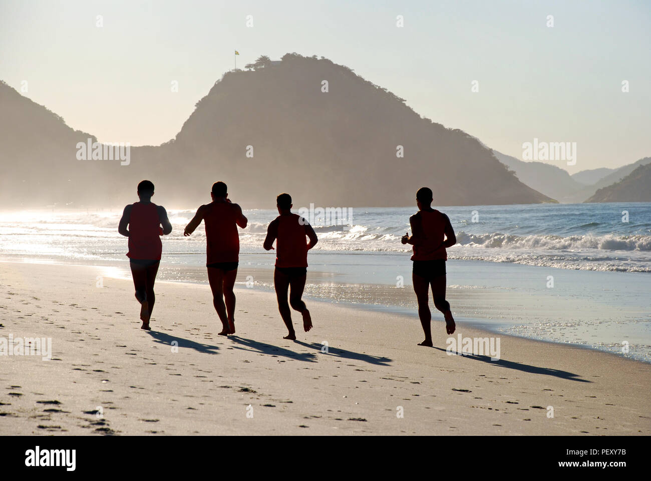 Man running on the Copacabana beach Stock Photo - Alamy