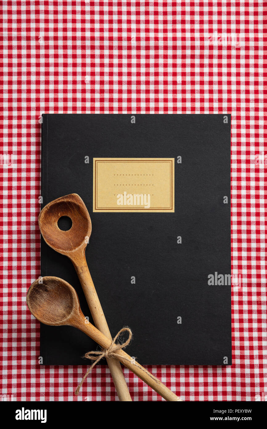 Cooking recipes book. Notebook and wooden kitchen utensils on red ...