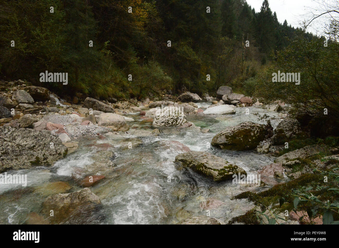 Stunning photo of flowing water in a river in Dolomite Italy Stock ...