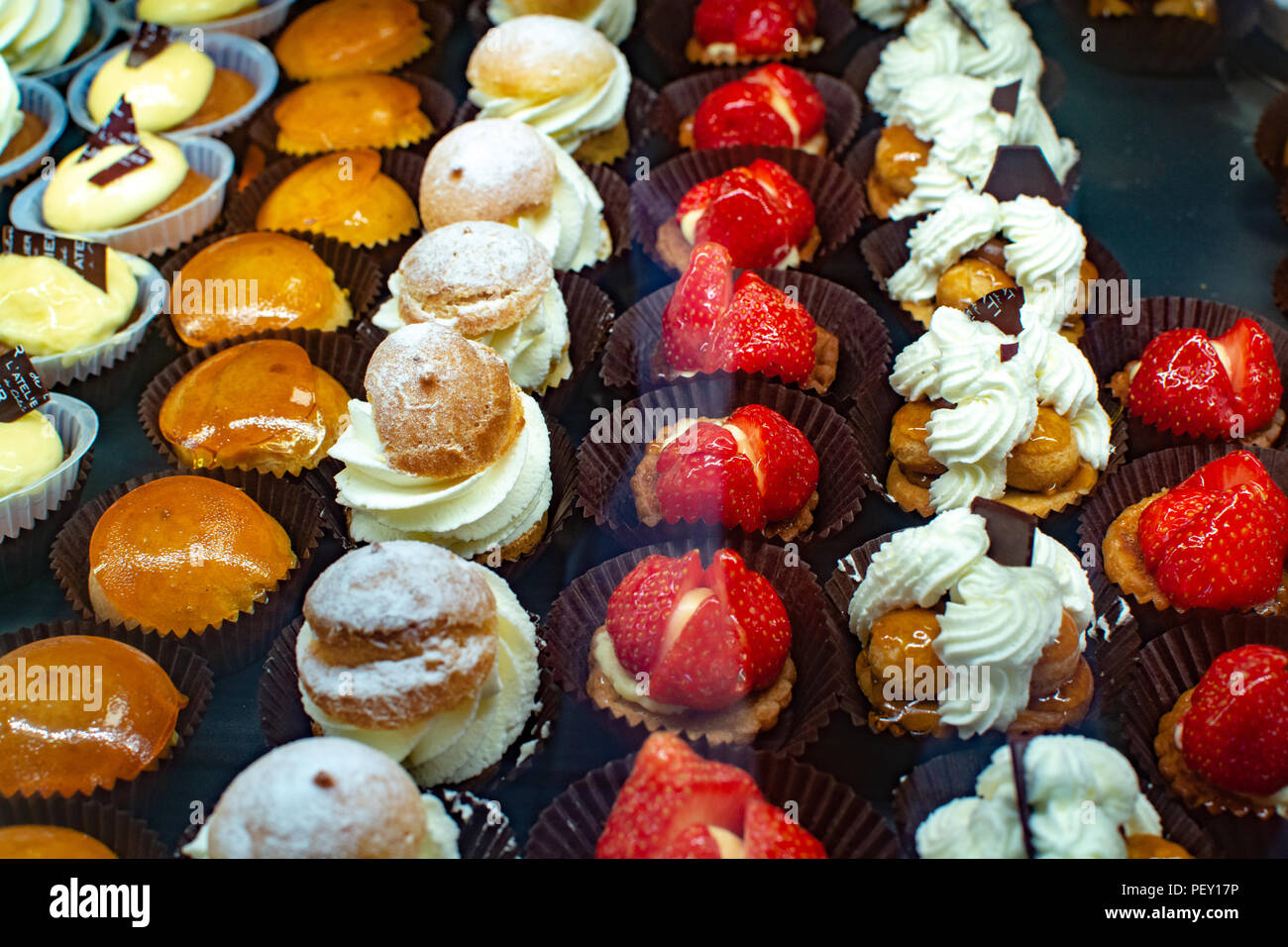 Variety of Fresh baked homemade cakes in small French bakery in ...