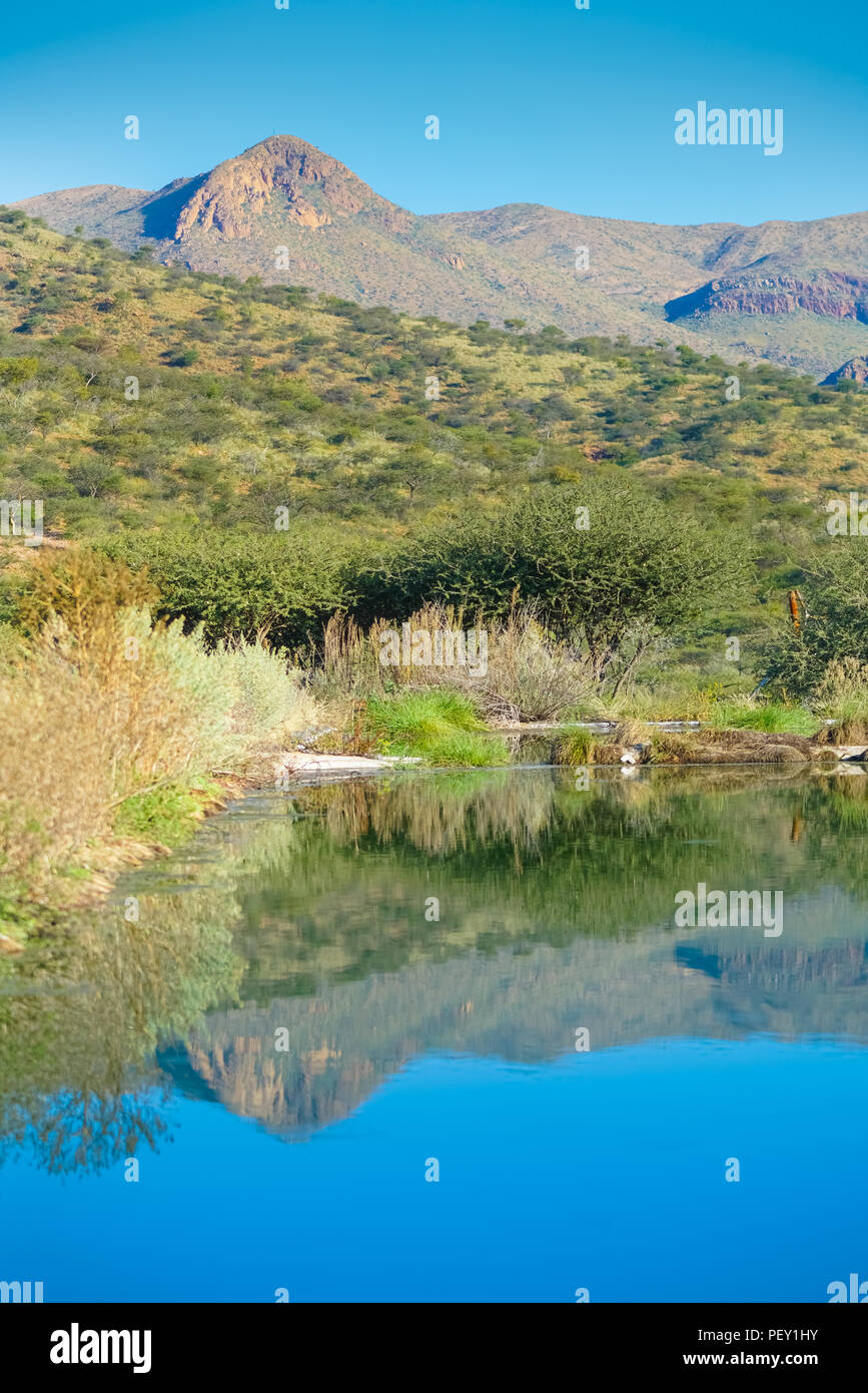 Characteristic hills around Namibian capital Windhoek under blue sky ...