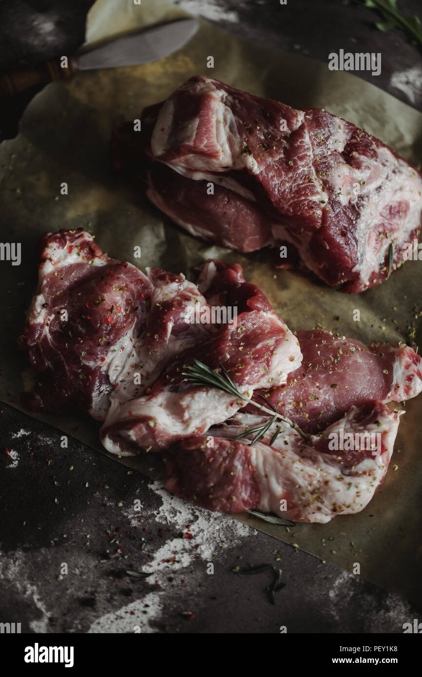 Food photography. Raw meat on craft bakery paper. Rustic color style ...