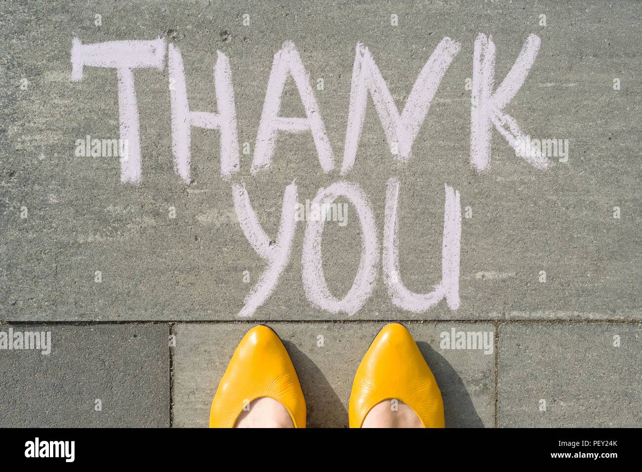 Female feet with text thank you written on grey sidewalk Stock Photo ...