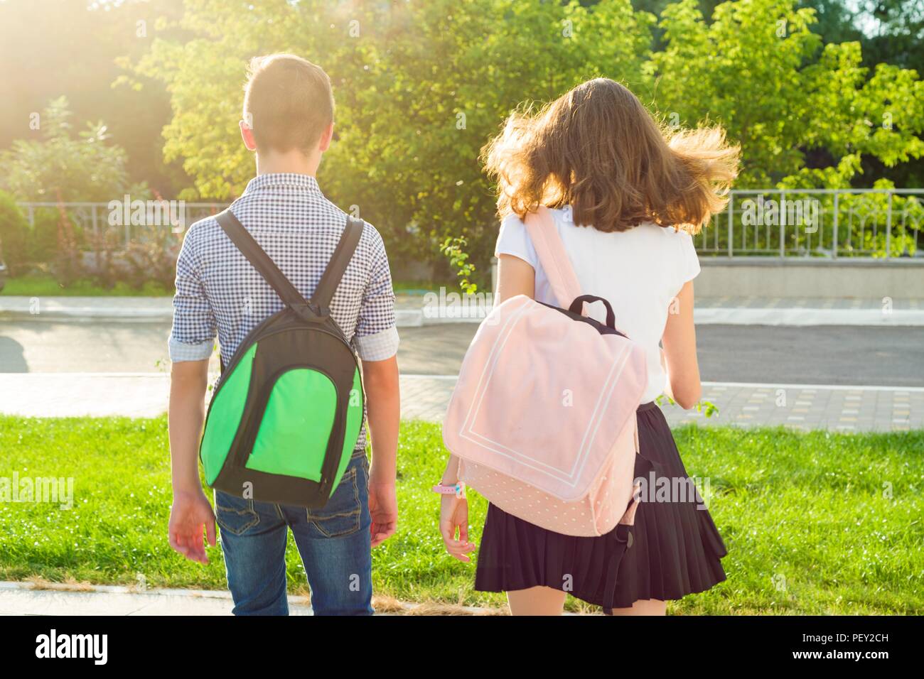 Elementary school pupils happy students with bag walking together hi ...