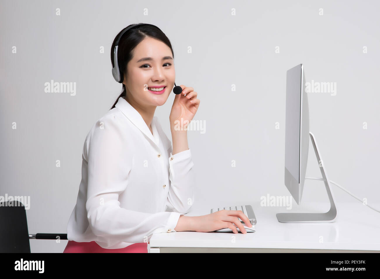 Customer support operators working in call center office, wearing ...