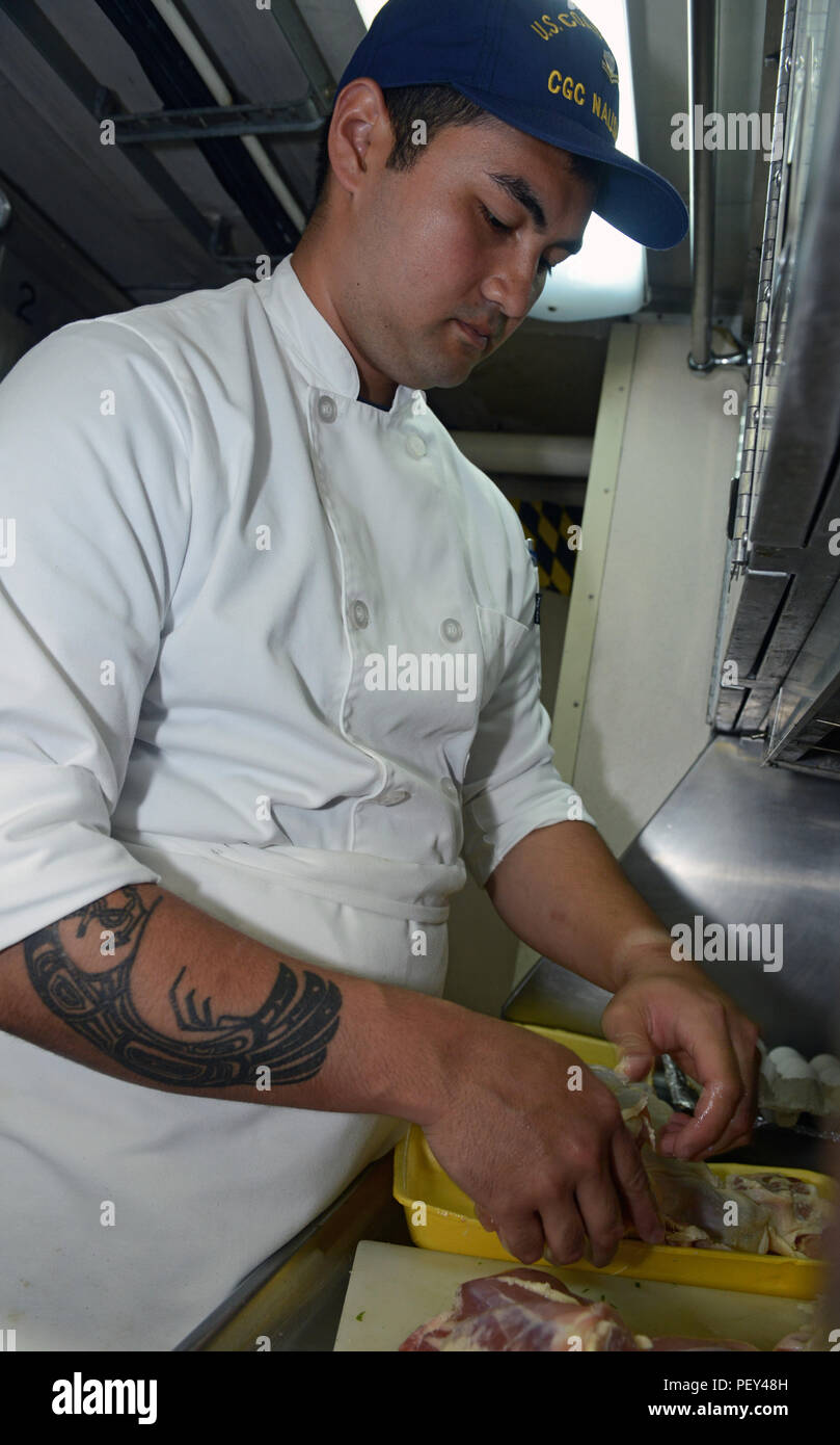 Petty Officer 2nd Class Jonah Patterson prepares a meal aboard the ...