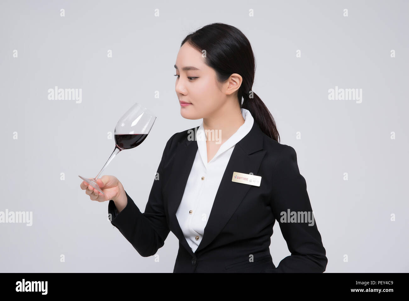 Catering services. Sommelier woman checking taste, smelling a wine ...
