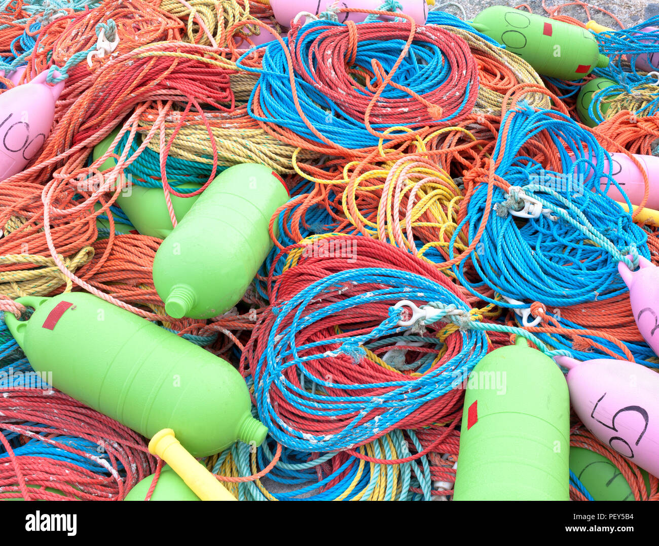Colorful industrial fishing ropes and buoys Stock Photo - Alamy