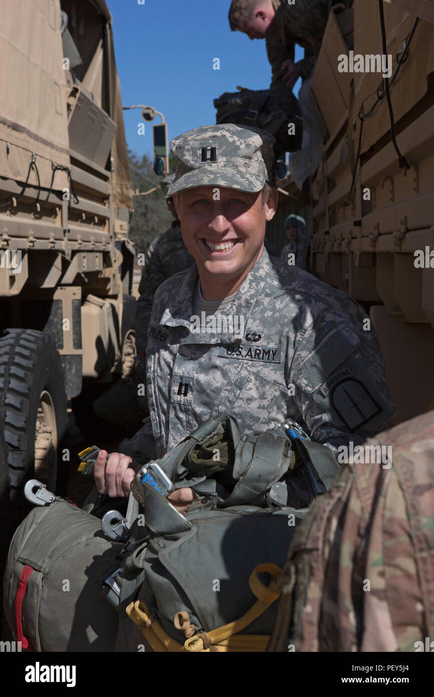 Capt. Pruden of the 112th Signal Battalion smiles while receiving his ...
