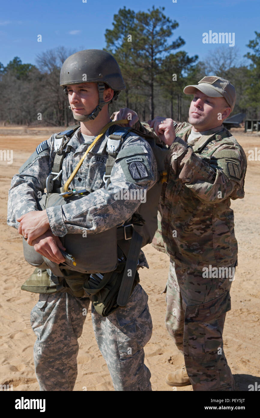 A U.S. Army jumpmaster from the 112th Signal Battalion checks the ...