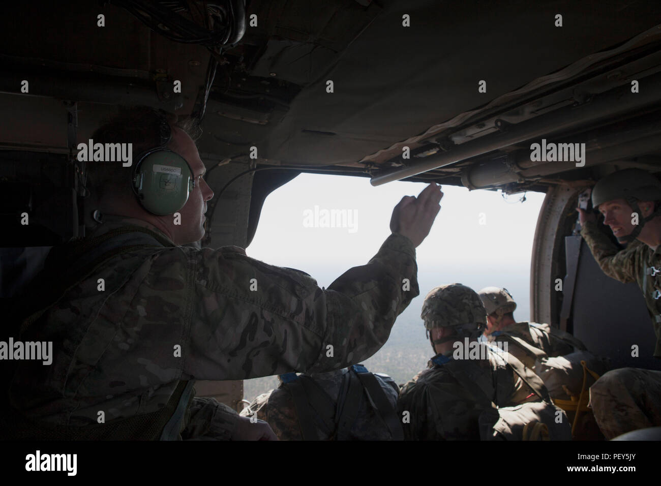 A U.S. Army jumpmaster gives the command of execution for paratroopers ...