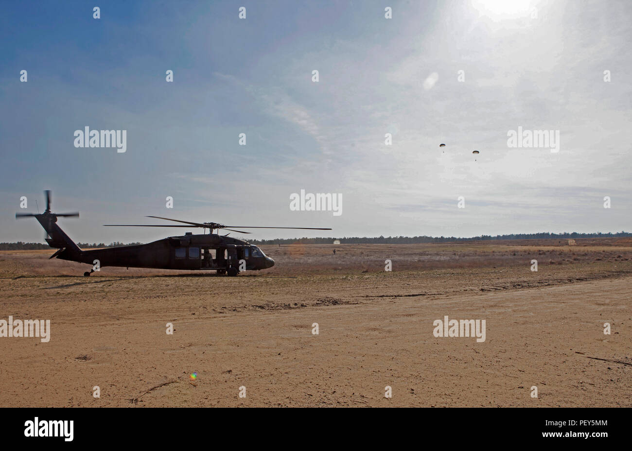 A UH-60 Black Hawk waits on Luzon Drop Zone for the next lift of ...