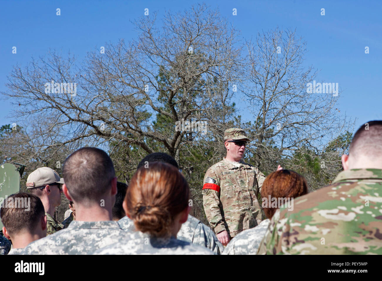 A U.S. Army jumpmaster briefs paratroopers prior to boarding a UH-60 ...