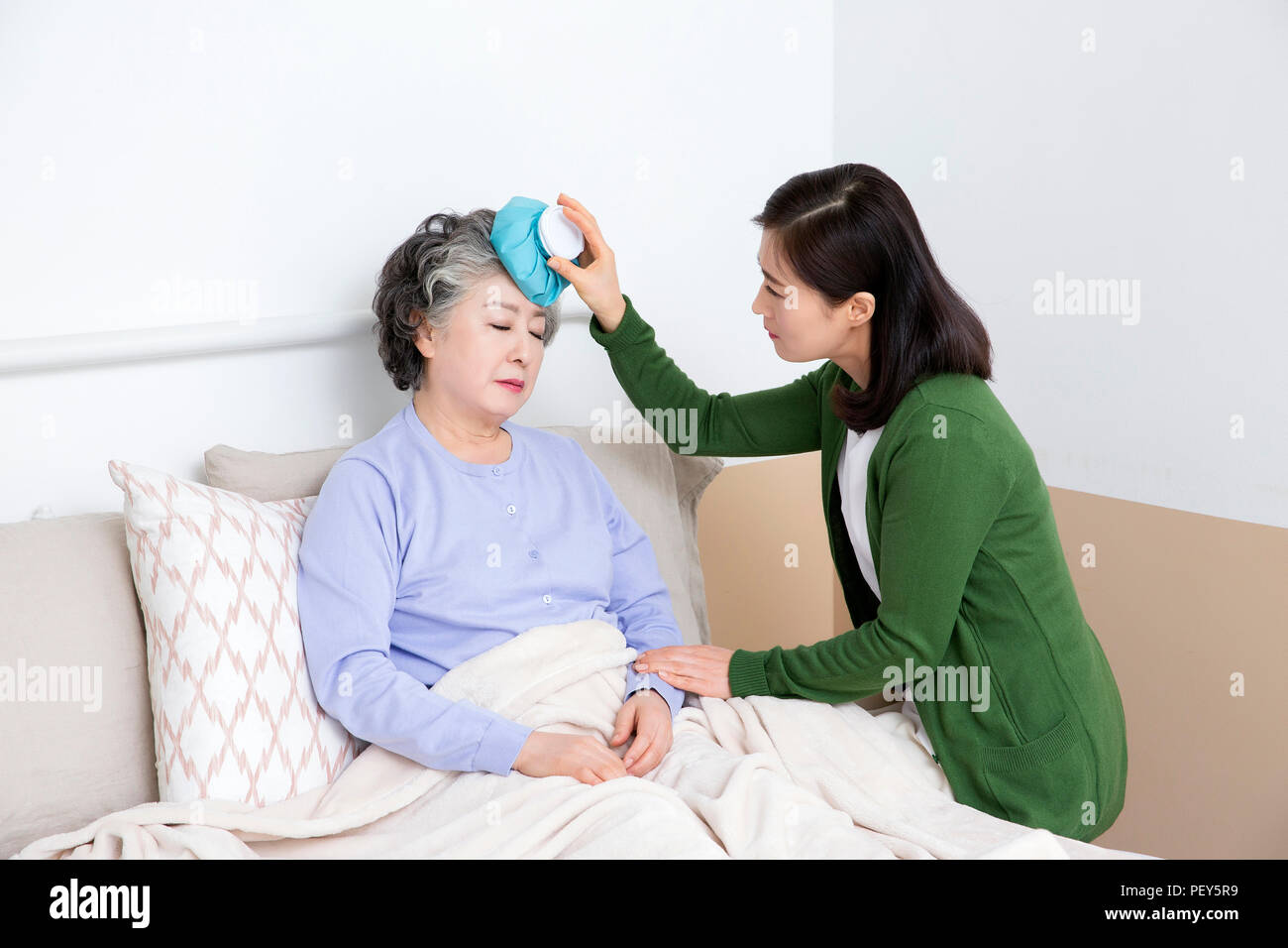 Photo of elderly woman with the caregiver, carer giving helping for the ...