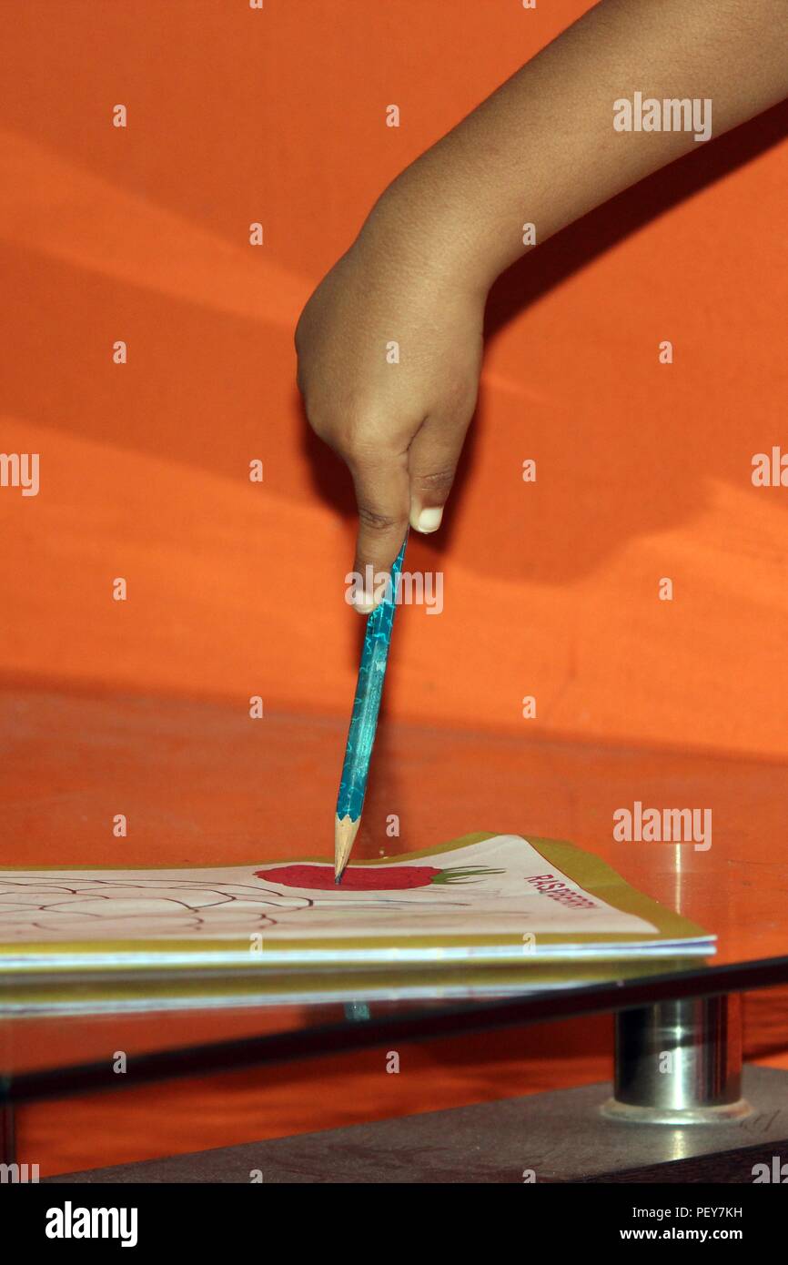 Child writing with pencil hi-res stock photography and images - Alamy