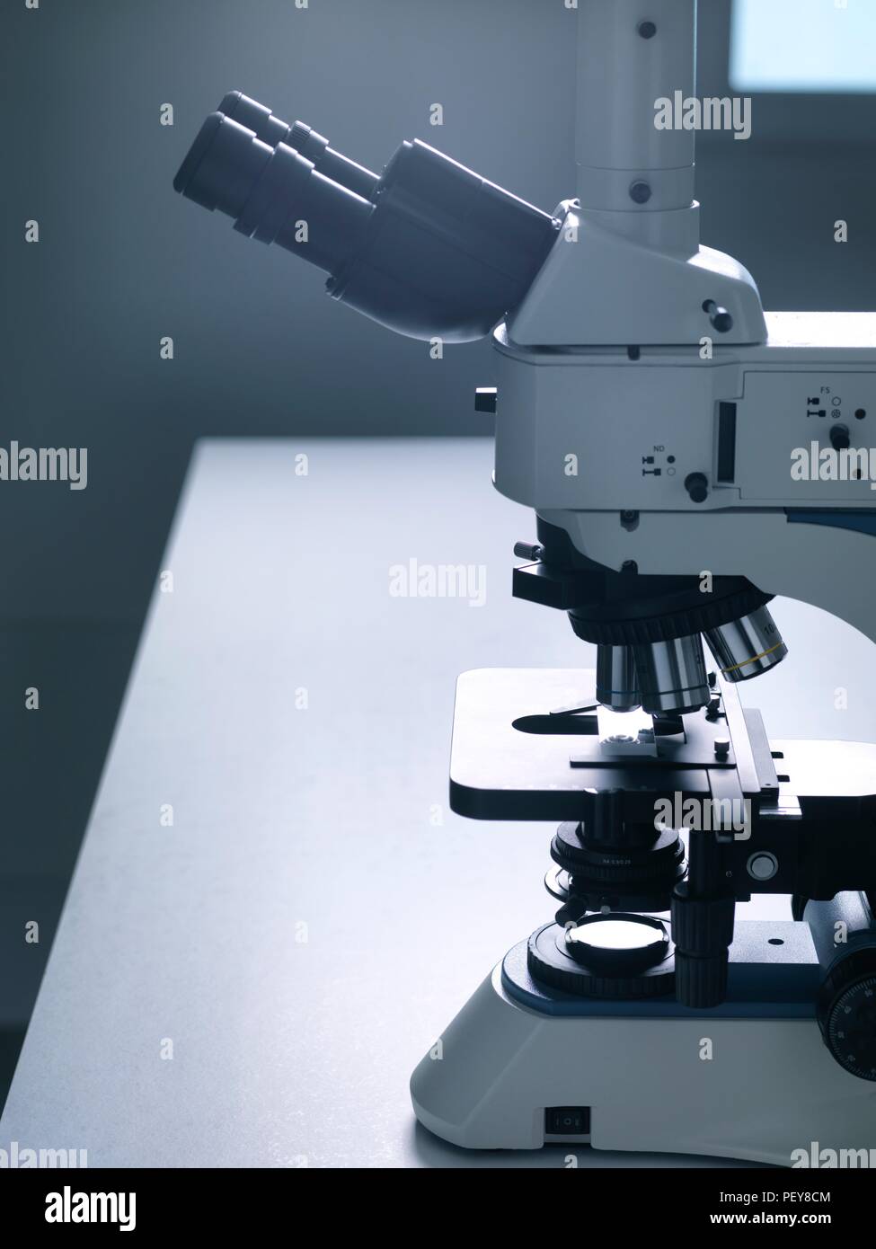 Still life of a microscope on a laboratory bench to illustrate research ...