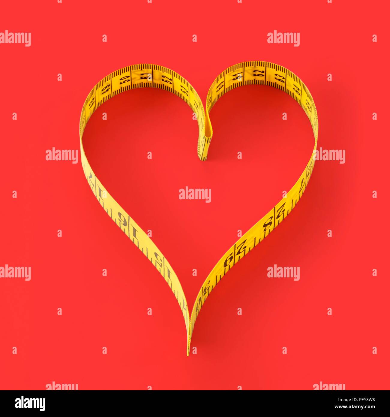 Measuring tape in the shape of a heart Stock Photo - Alamy