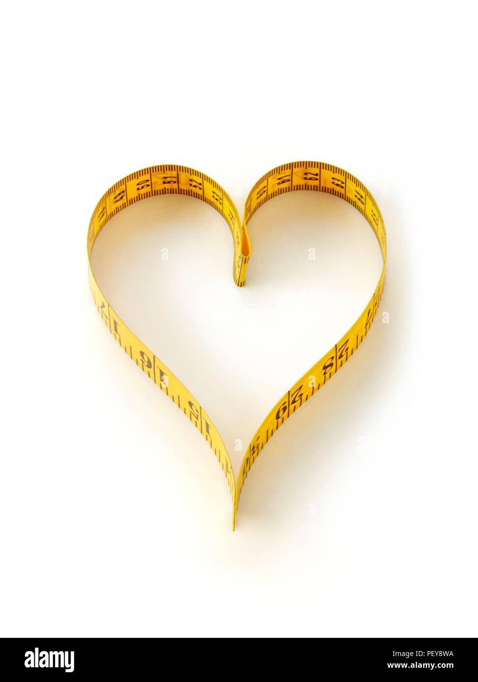 Measuring tape in the shape of a heart Stock Photo - Alamy
