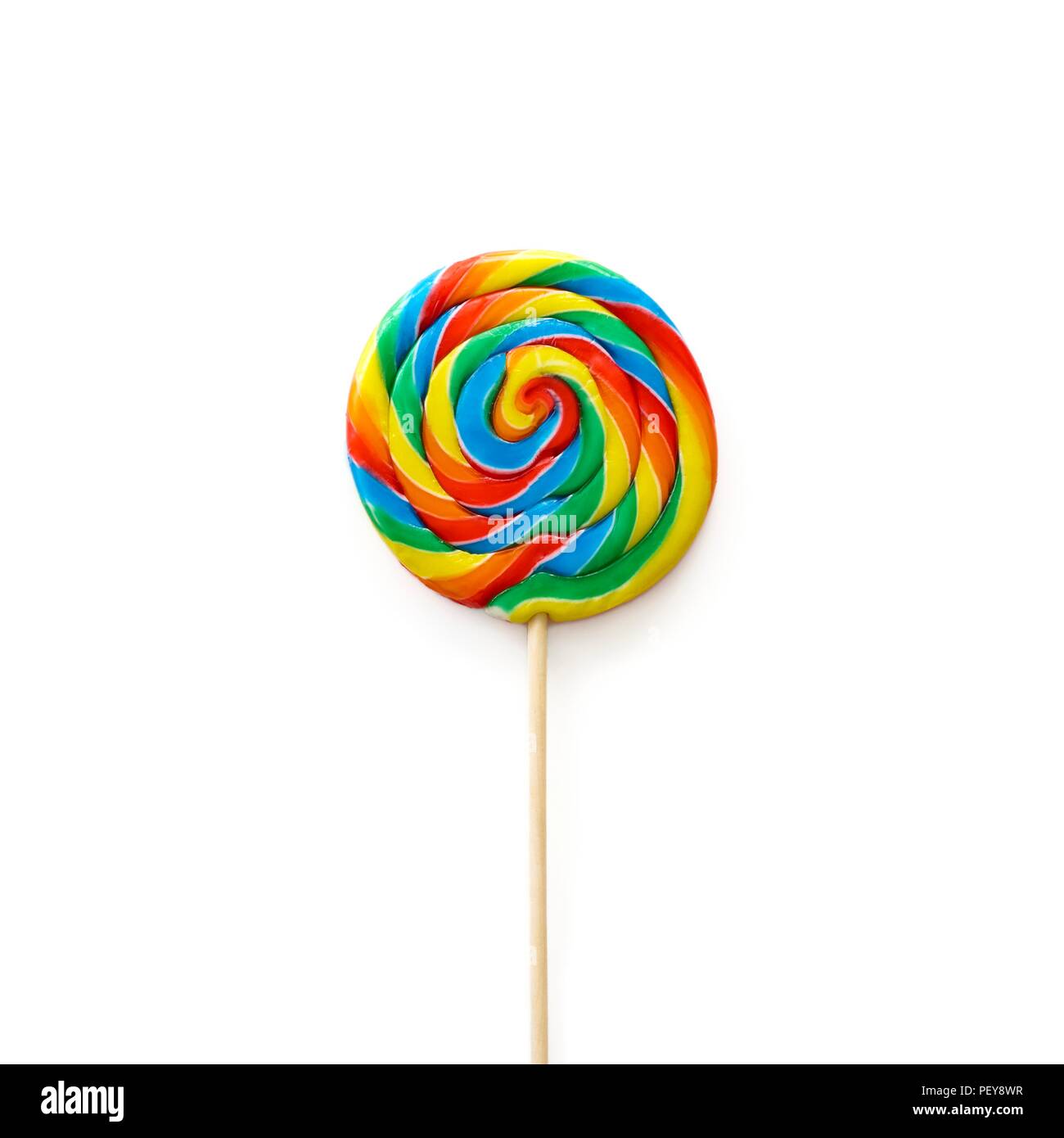 Bright coloured lollipop against a white background Stock Photo - Alamy