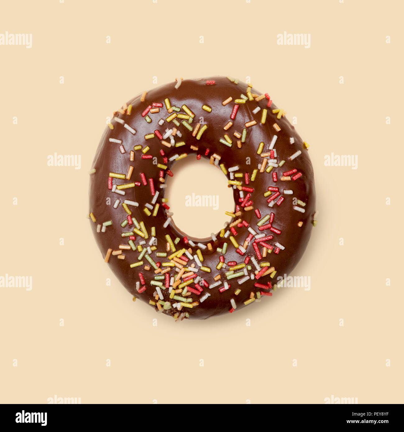 Chocolate doughnut with sugar strands, studio shot Stock Photo - Alamy