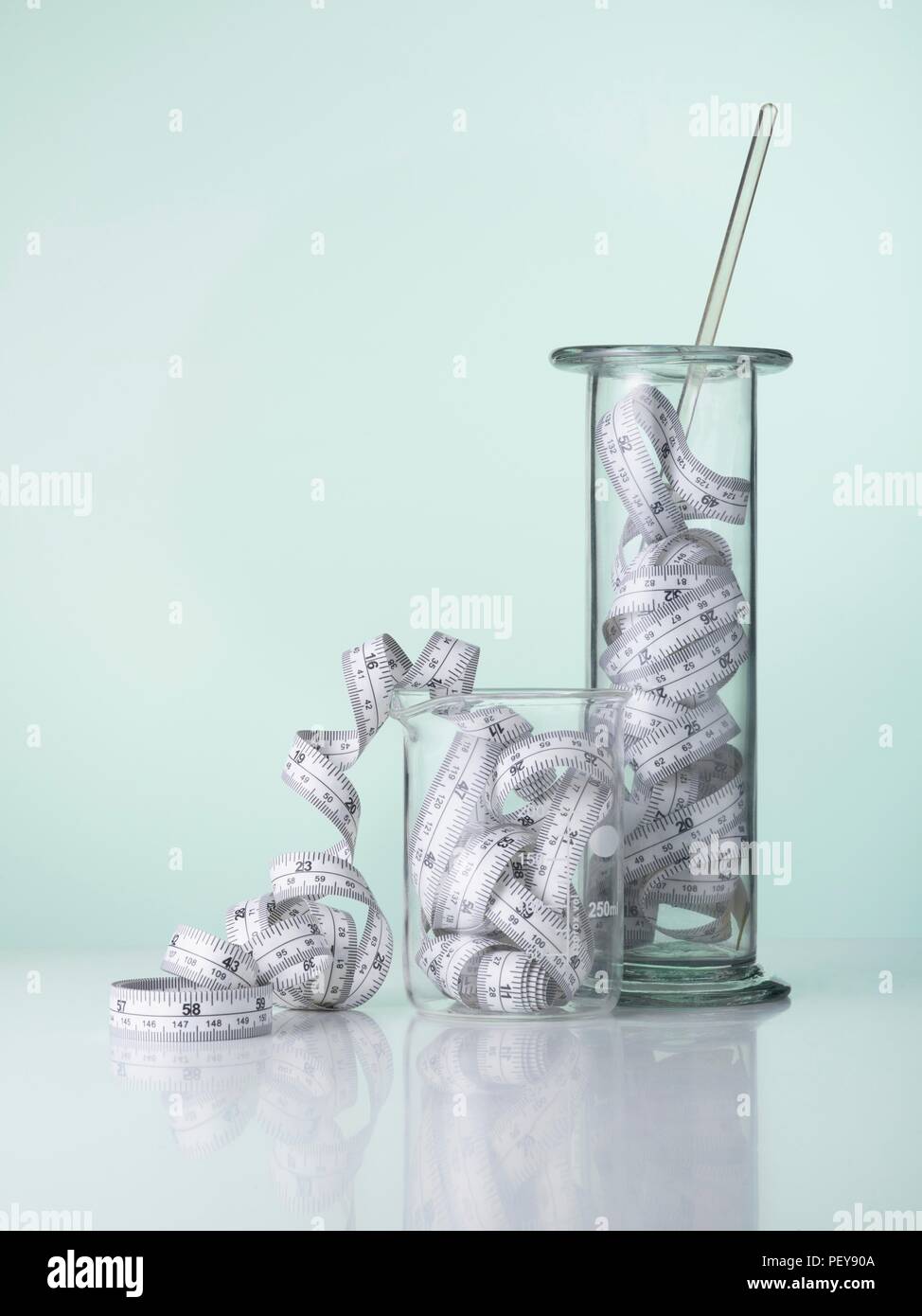 Laboratory glassware with tape measures Stock Photo - Alamy