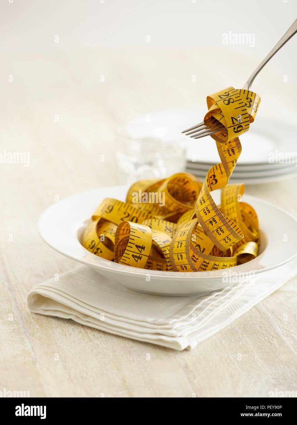 Pasta bowl with tape measure Stock Photo - Alamy