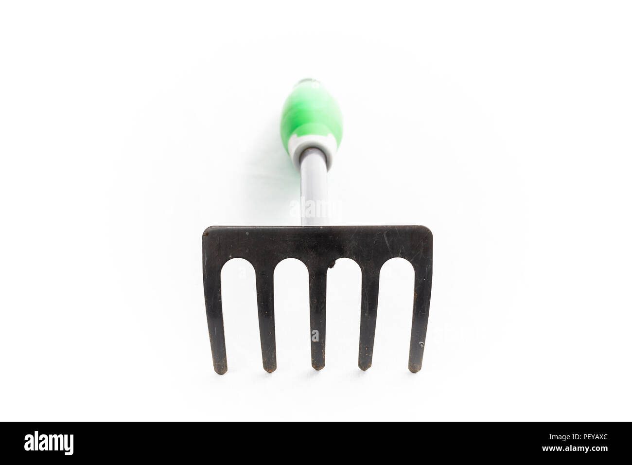 small rake gardening 5 teeth with green handle on white background ...