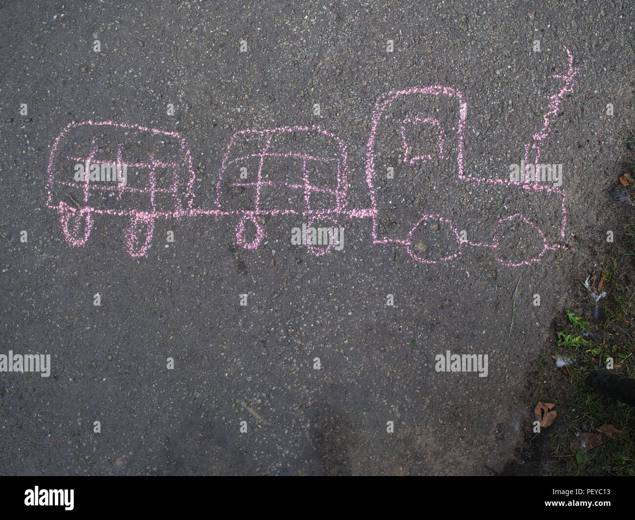 Train sketching with chalkon asphalt Stock Photo - Alamy