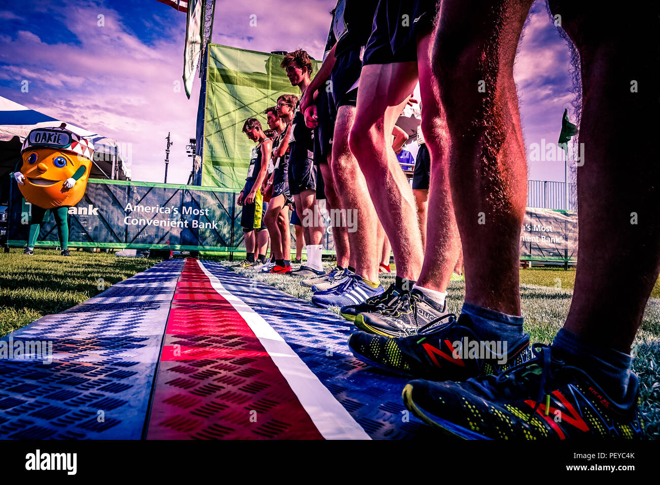 A close up of runners lined up at the starting line before the start of ...