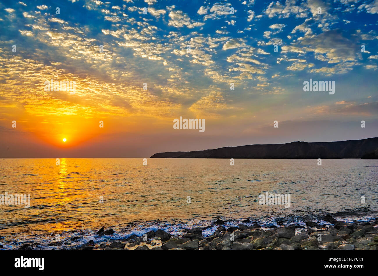 Beautiful Sunrise on the beach. Full view of the ocean, the waves ...