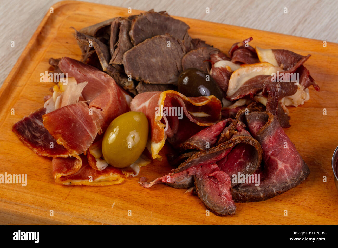 Meat plate mix snack with olive Stock Photo - Alamy
