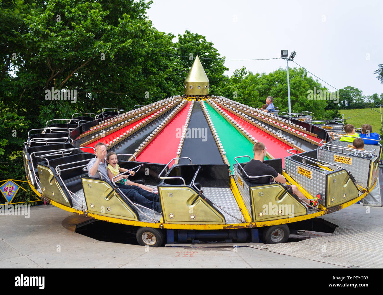 Family on fairground ride hi-res stock photography and images - Alamy
