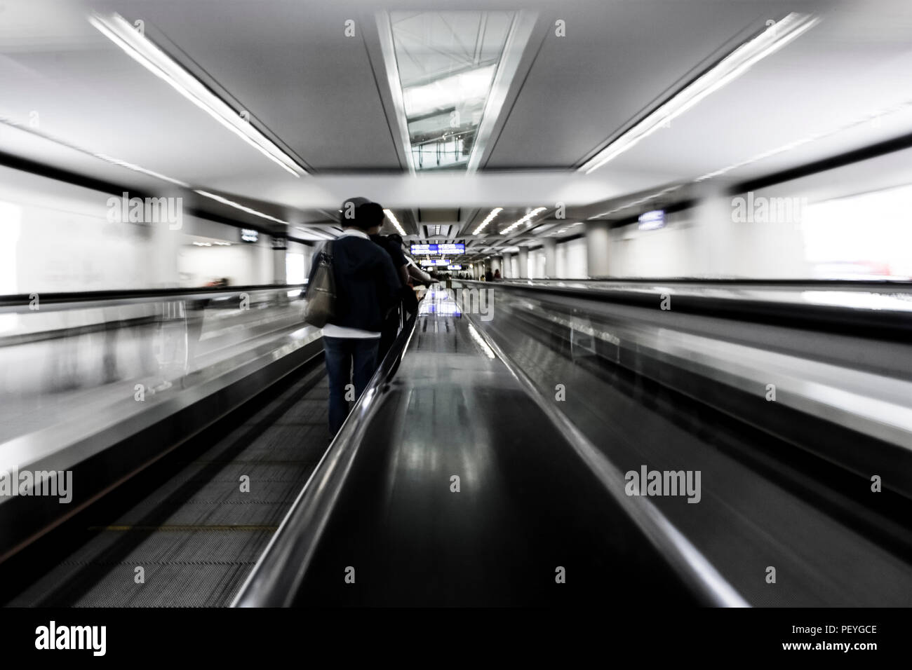 Traveling through airport on escalator symbol for fast pace speed of ...