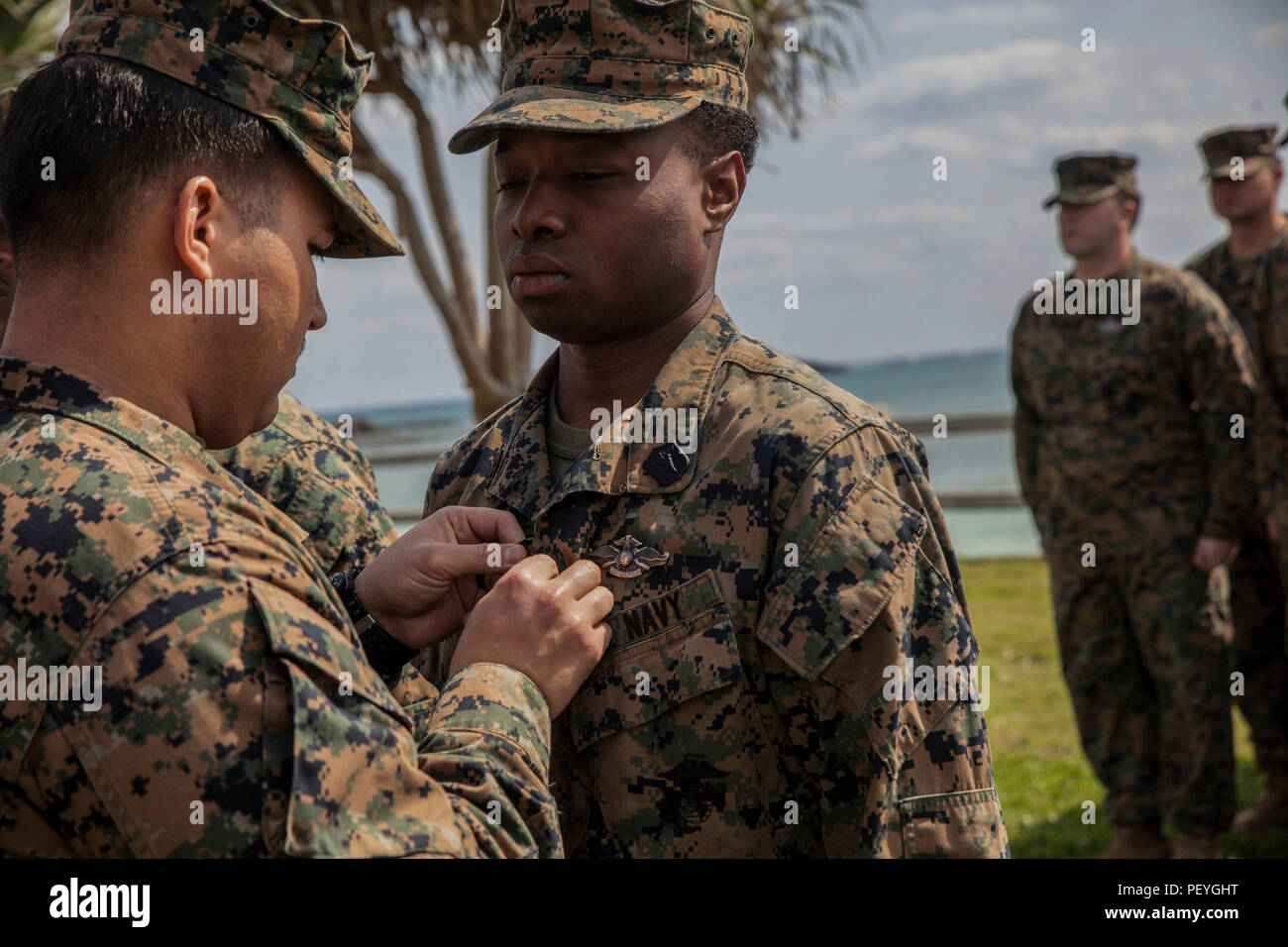 Navy Seaman Kevin Glover receives his Fleet Marine Force (FMF) Badge ...