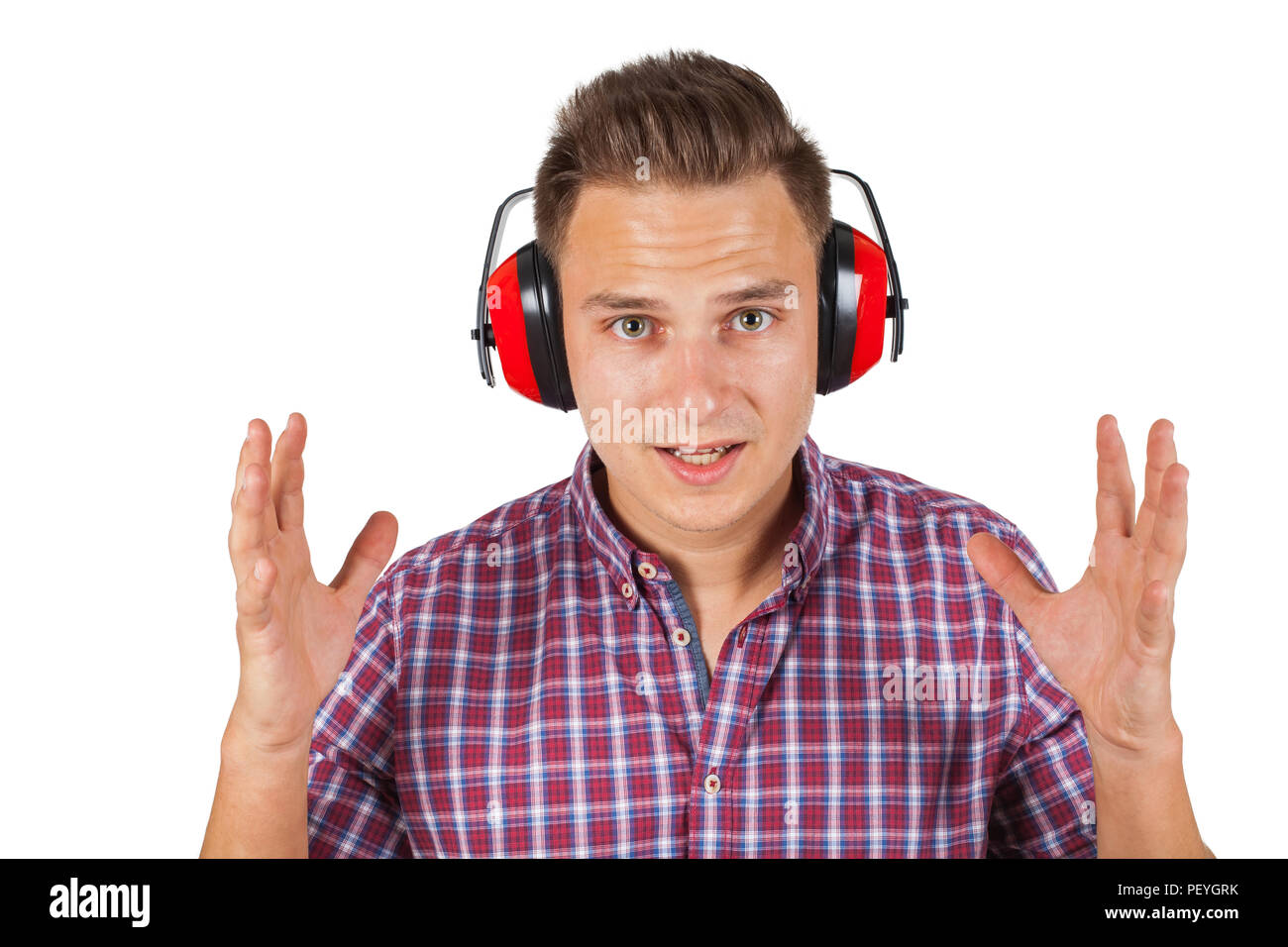 Young engineer on isolated background wearing noise cancelling headset ...