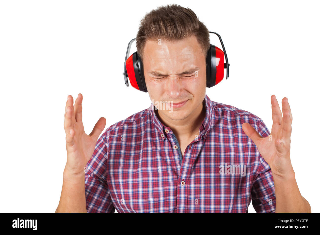 Young engineer on isolated background wearing noise cancelling headset ...