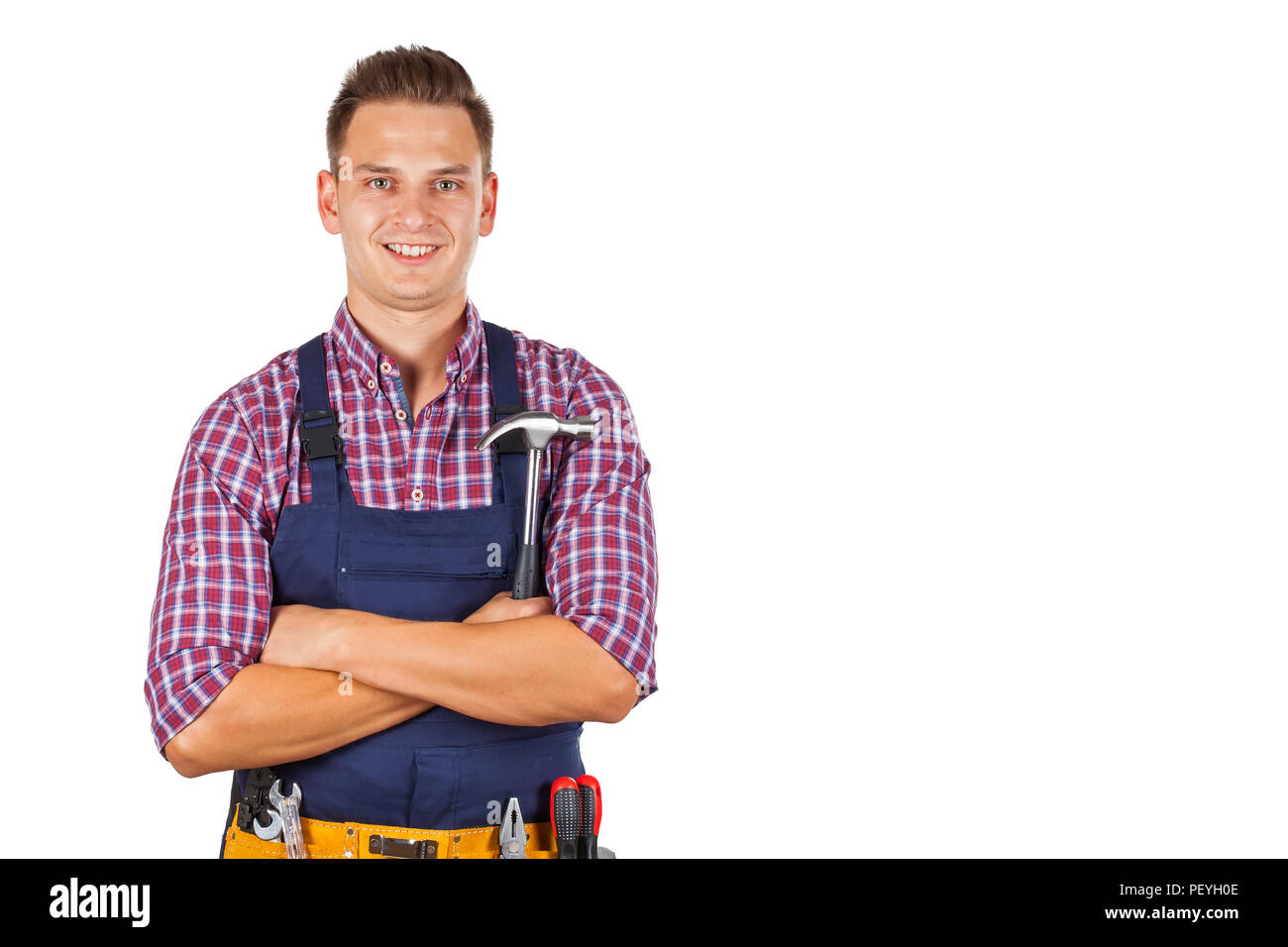 Portrait of handsome repairman holding tools,smiling to the camera on ...