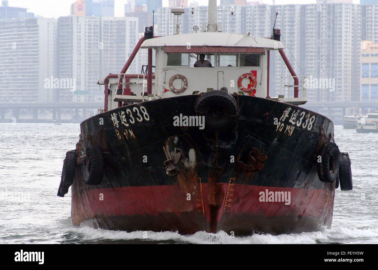 Empty waste bulk carrier barge, Victoria Harbour, Hong Kong Stock Photo ...