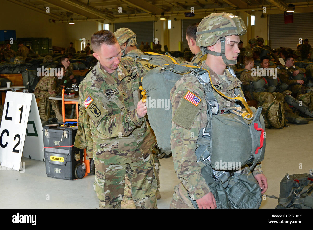 U.S. Army jumpmaster CW2 John Daniels, left, conducts a jumpmaster ...