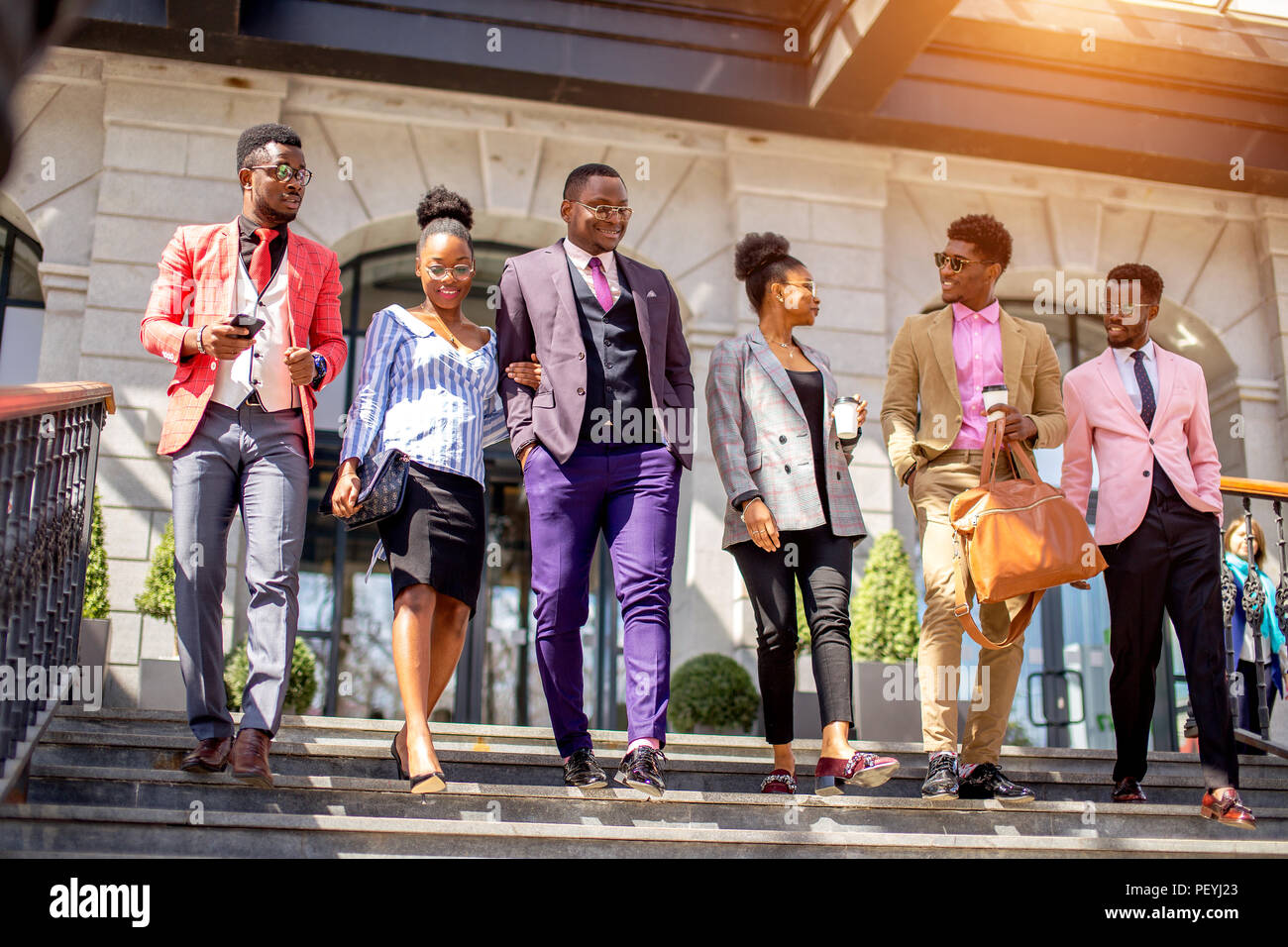 pleasant office workers leaving their workplace with positive ...