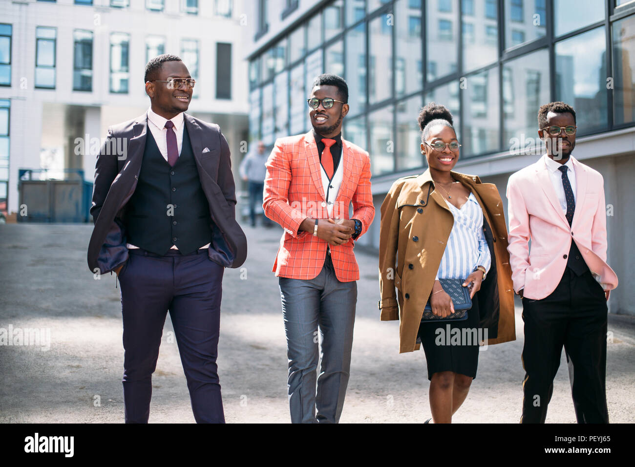 positive colleagues gtting of the work. clock off Stock Photo - Alamy