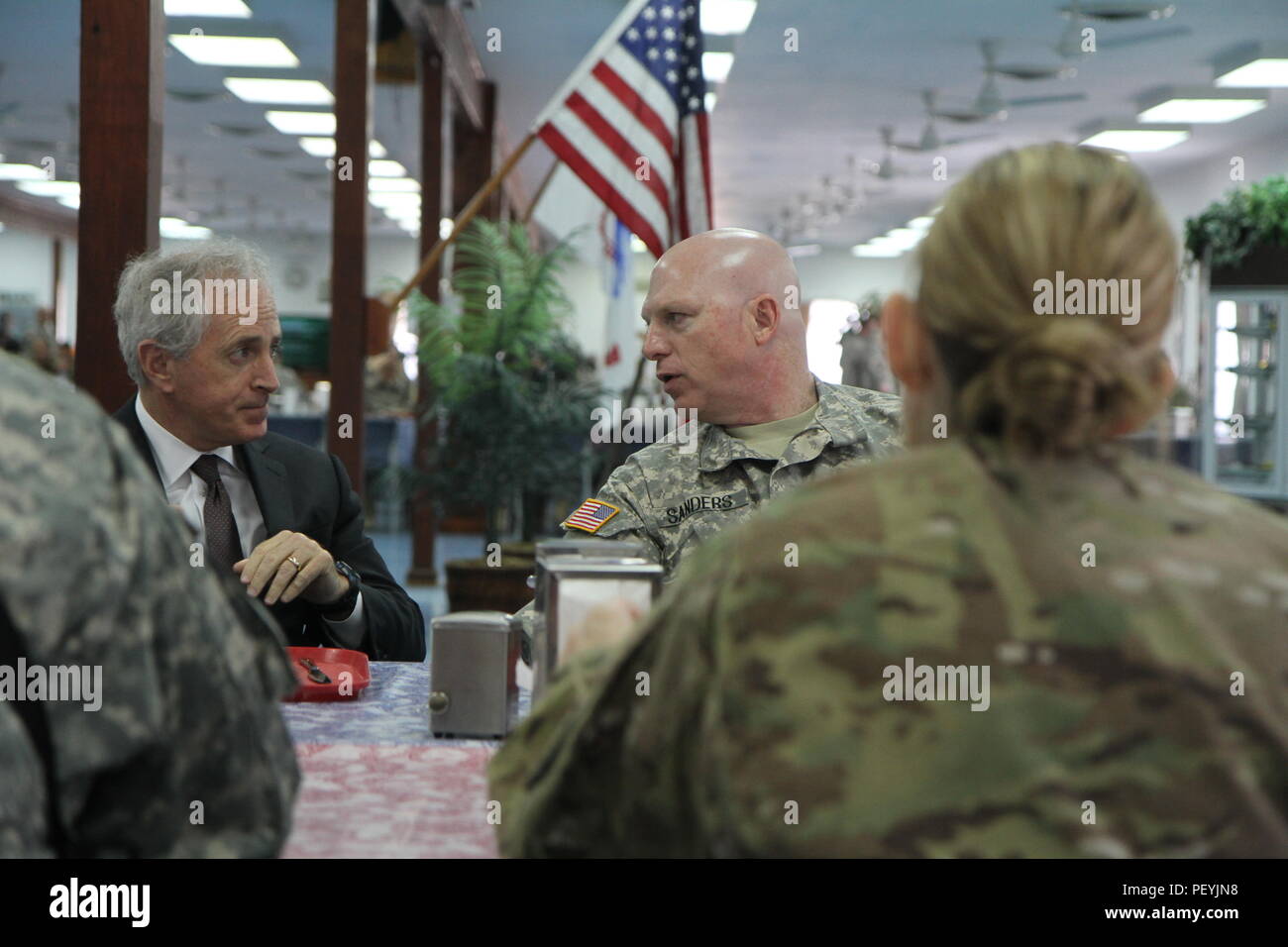 U.S. Sen. Bob Corker talks with Army Capt. Stanley Sanders, a ...