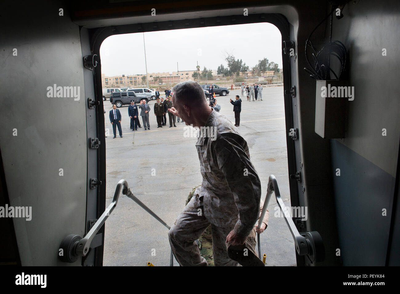 Chairman of the Joint Chiefs of Staff, Marine Gen. Joseph F. Dunford Jr., boards a C-17 ...