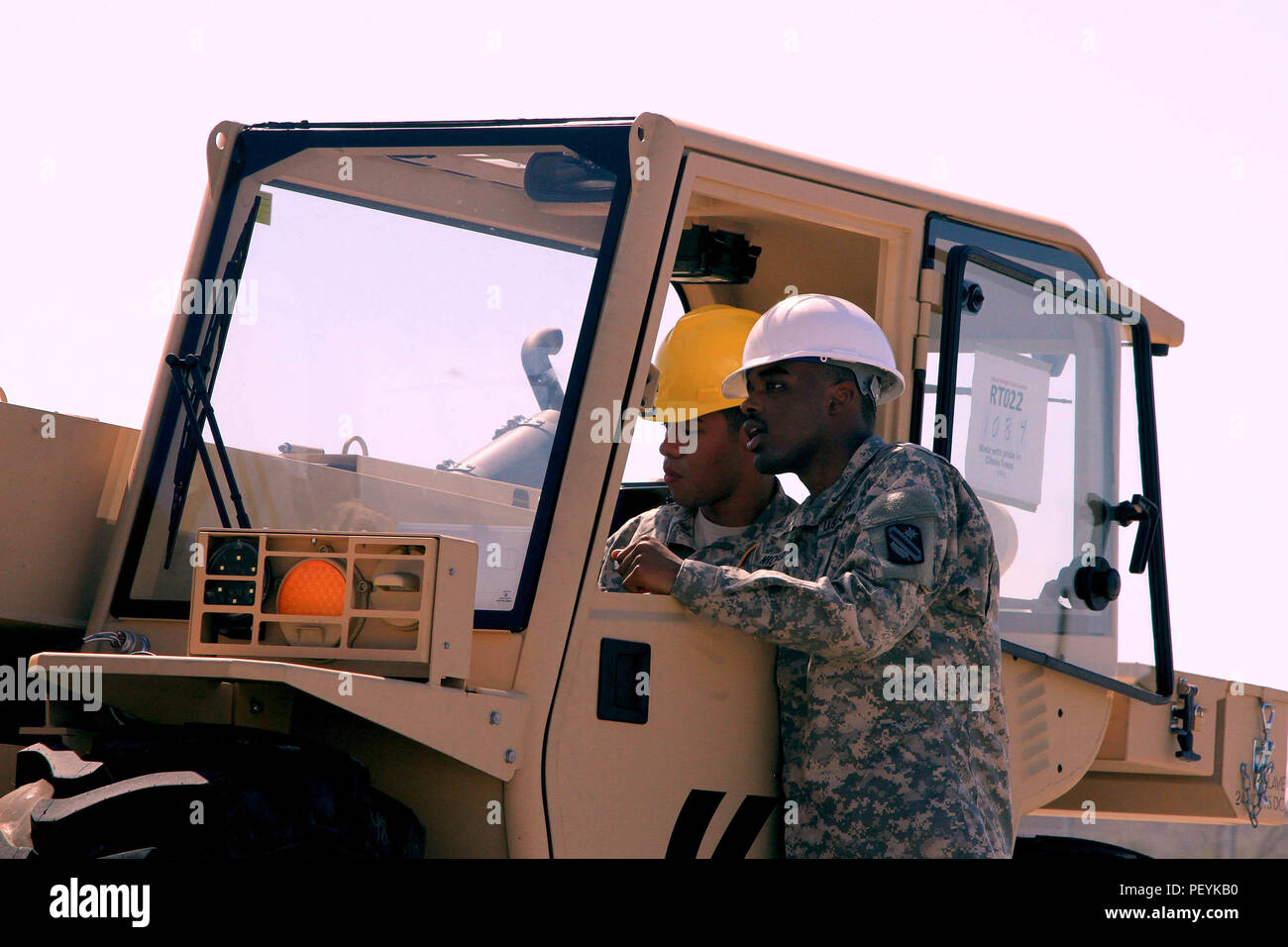 Spc. Baslock G. Lopez and Spc. Orlando D. Nicholas, cargo specialists ...